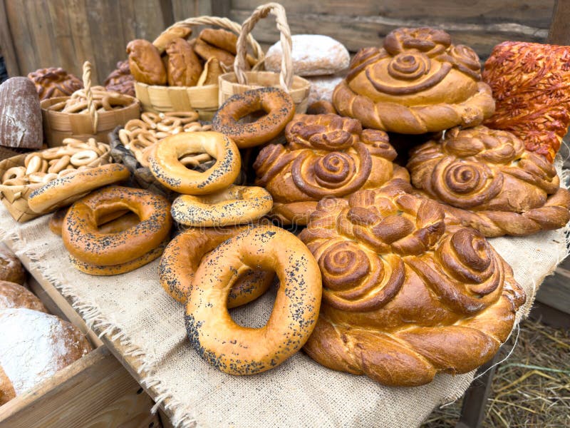 A Table Full of Different Types of Bread and Pastries Stock Photo ...