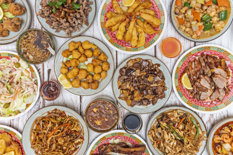 A Table Full of Dishes of Chinese Food Typical of Western Restaurants ...