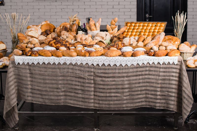 Table Full of Various Types of Fresh Bread. Wheat and Rye Breads Stock ...