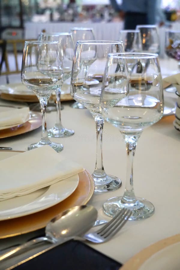 Table with Glasses Prepared for a Formal Dinner at a Wedding Stock ...