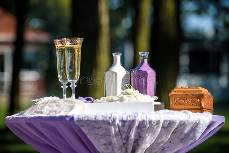 Table with Glasses of Sand Prepared for Sand Ceremony during Wedding of ...