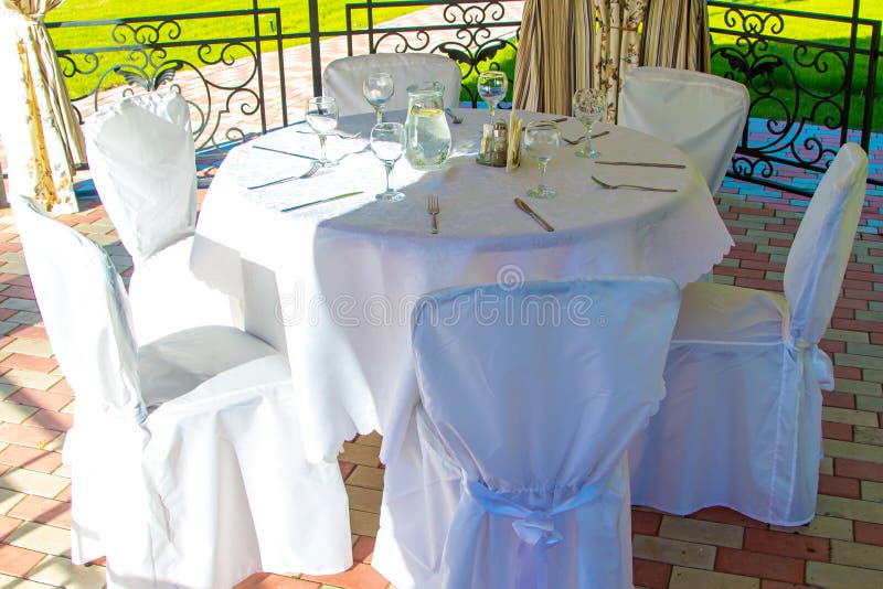 Table with Glasses in Summer Bower Stock Photo - Image of setting ...