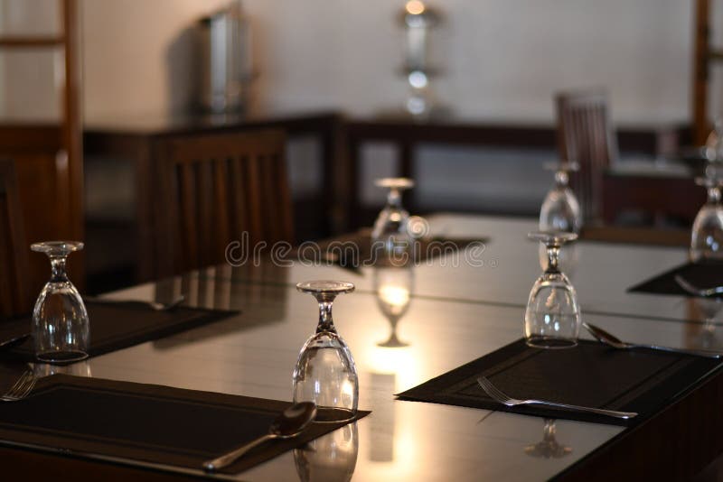 Table with Glasses Upside Down on Napkins with Spoons and Forks Stock ...