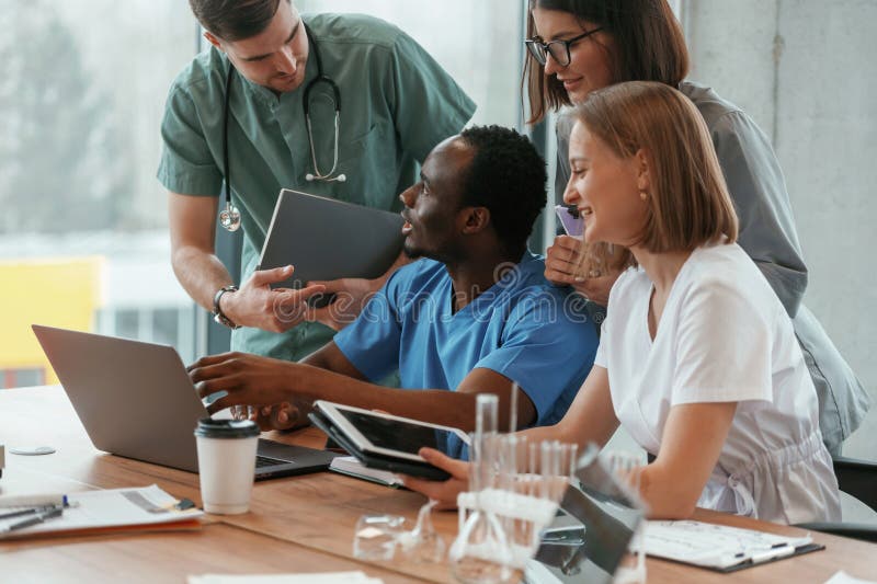 By the Table. Group of Doctors are Together Indoors Stock Photo - Image ...