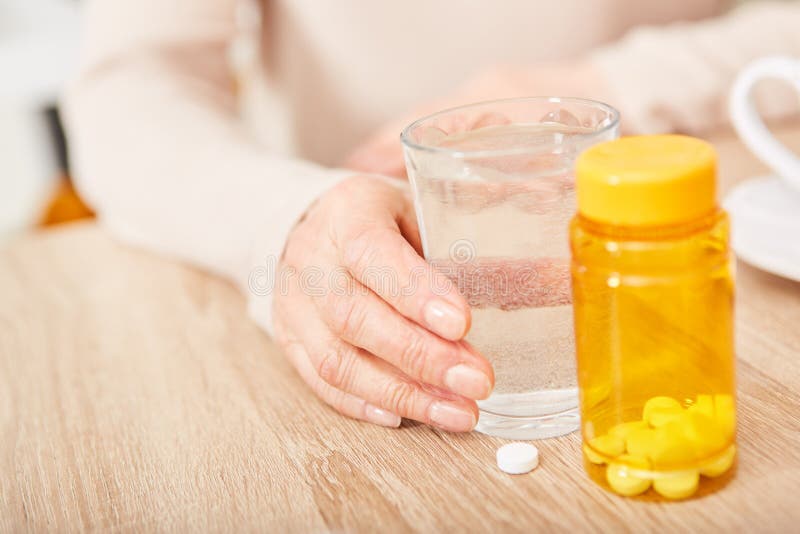 Table with tablets dosage stock image. Image of tablets - 149262801