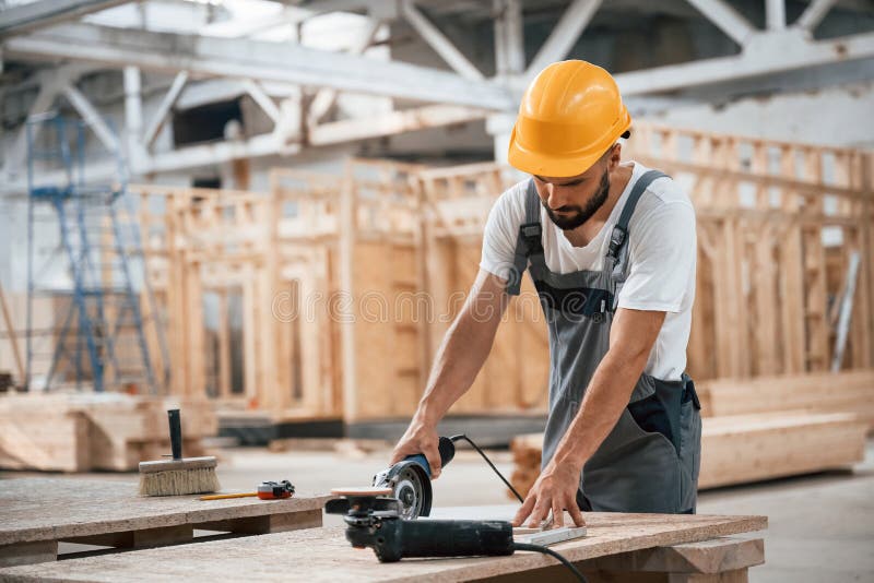 By the Table. Industrial Worker in Wooden Warehouse Stock Illustration ...