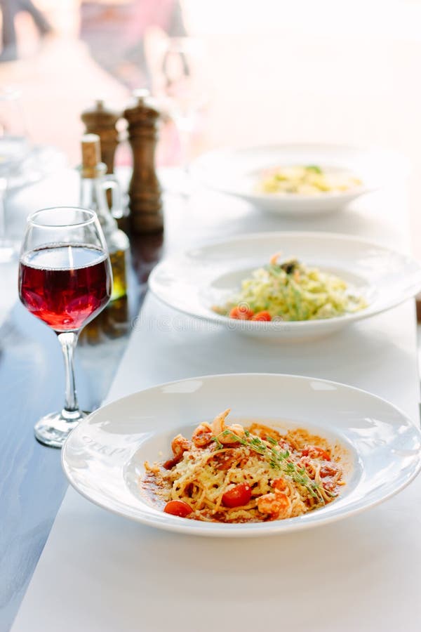 Table in a Italian Restaurant Served with Italian Pasta. Stock Image ...