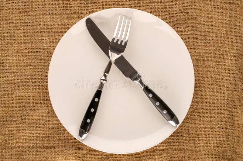 Metal Cutlery with Ceramic Dishes, Close-up, Top View and Isolated on ...