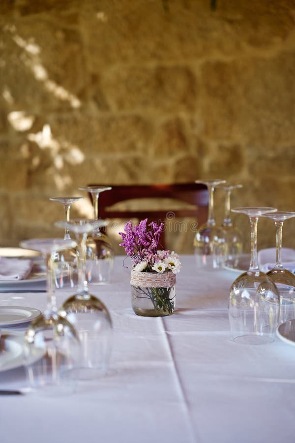 Table Laid with Glasses and Flowers, Vertical Image Stock Image - Image ...