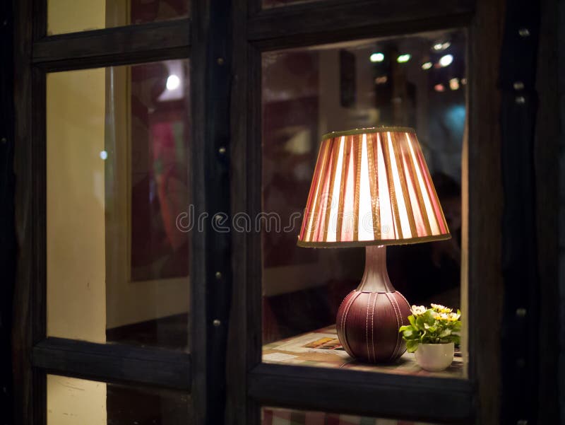 Table lamp behind window stock photo. Image of frame - 30488636