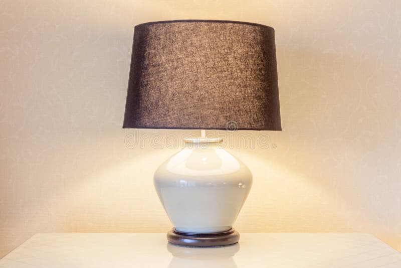 Table Lamp and Its Shadow on Wallpaper in the Bedroom Stock Photo ...