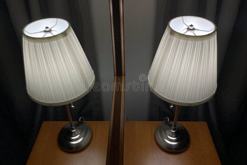 Table Lamp with Lampshade on the Table in Front of a Mirror Stock Photo ...