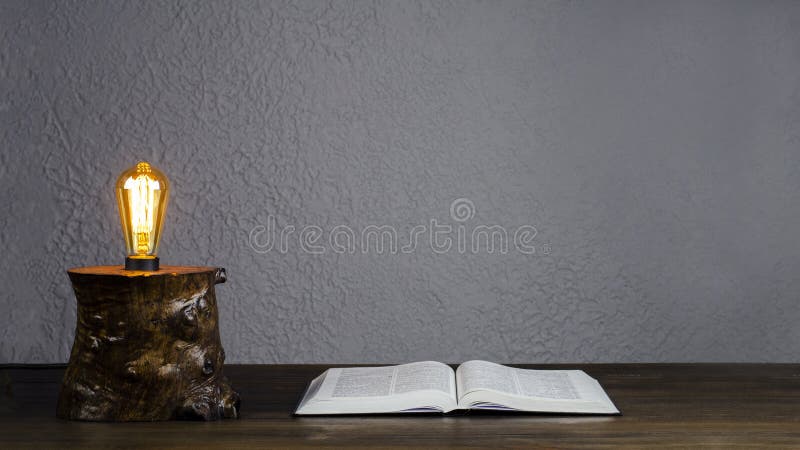 Table Lamp. Open Book. Light from the Lamp. Open Bible. Stock Photo ...