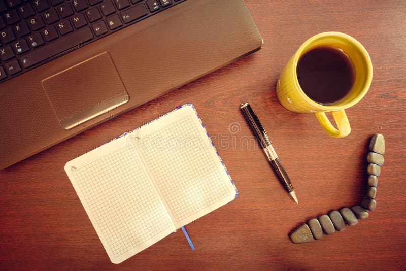Table with Laptop, Notebook, Pen and Cup of Tea Stock Image - Image of ...