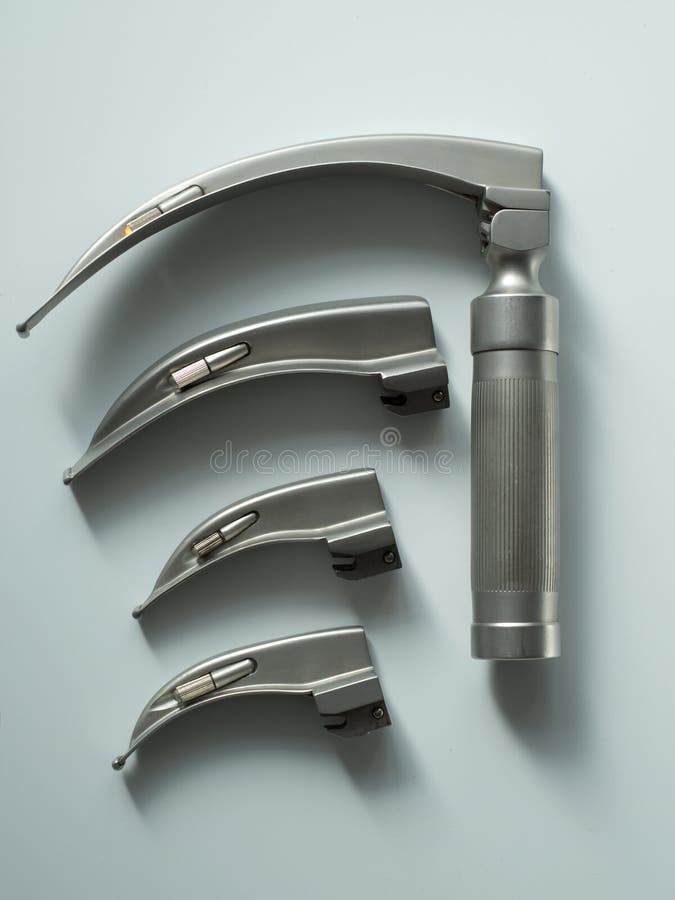 On the Table is a Laryngoscope with a Set of Curved Blades. Stock Photo ...