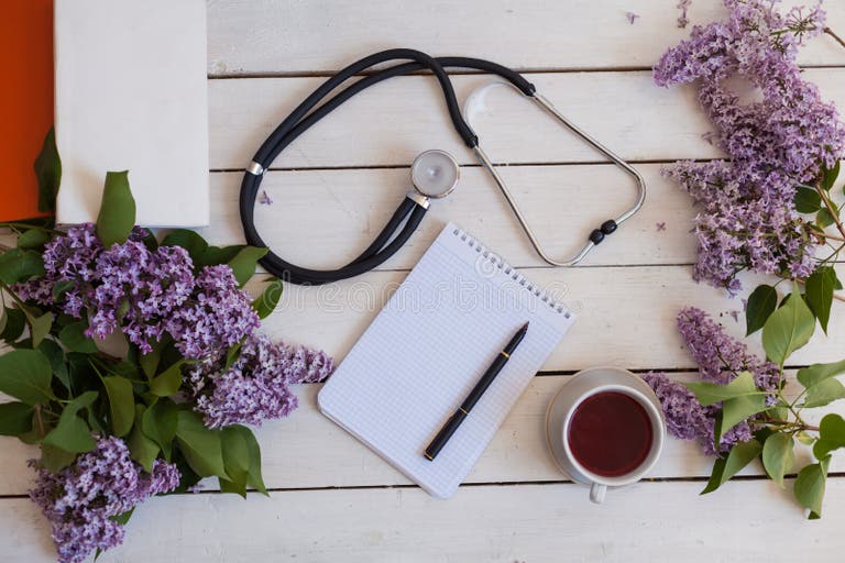 On the Table Lay a Lilac, Stethoscope, Notebook Stock Image - Image of ...