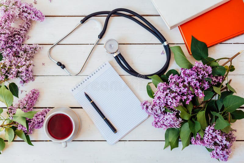On the Table Lay a Lilac, Stethoscope, Notebook Stock Photo - Image of ...