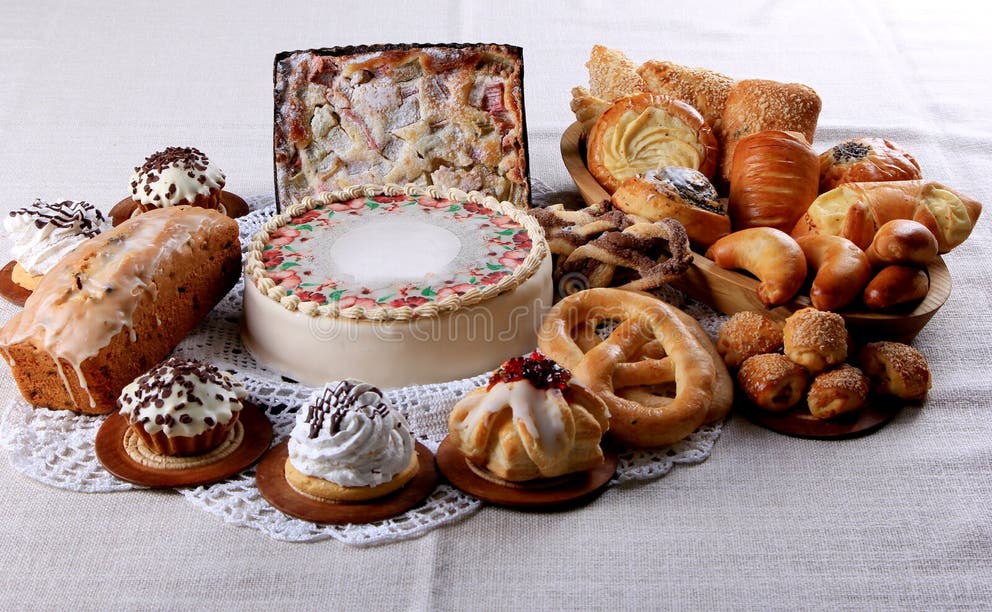 Table with Loads of Cakes, Cupcakes and Pies. Cake Selection on White ...
