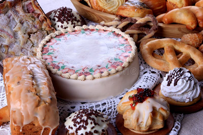 Table with Loads of Cakes, Cupcakes and Pies. Cake Selection on White ...