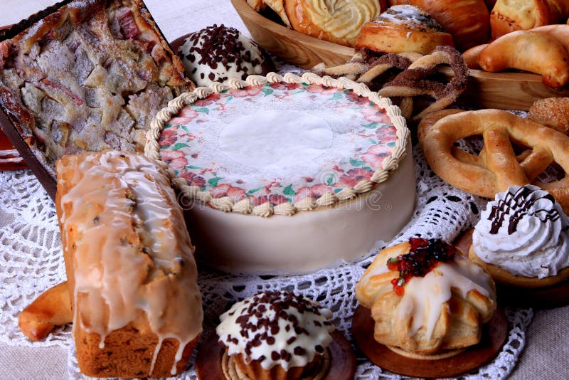 Table with Loads of Cakes, Cupcakes and Pies. Cake Selection on White ...
