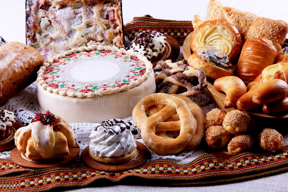 Table with Loads of Cakes, Cupcakes and Pies. Cake Selection on White ...