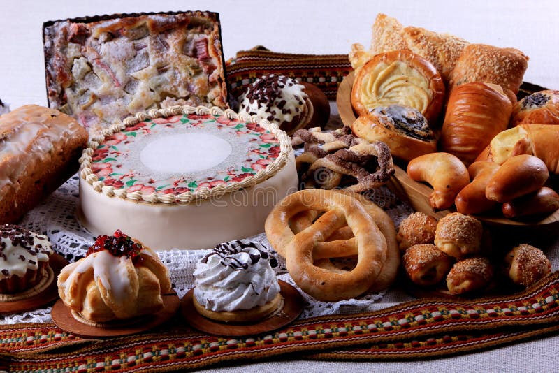 Table with Loads of Cakes, Cupcakes and Pies. Cake Selection on White ...