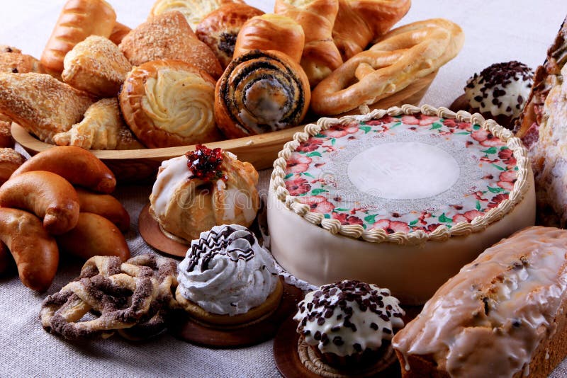 Table with Loads of Cakes, Cupcakes and Pies. Cake Selection on White ...