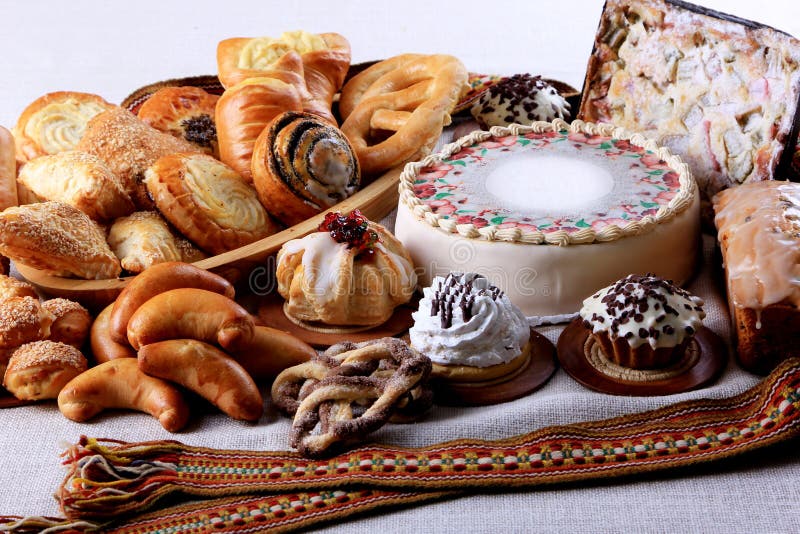 Table with Loads of Cakes, Cupcakes and Pies. Cake Selection on White ...