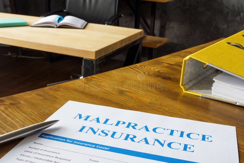 Table with Malpractice Insurance Application on it. Stock Photo - Image ...