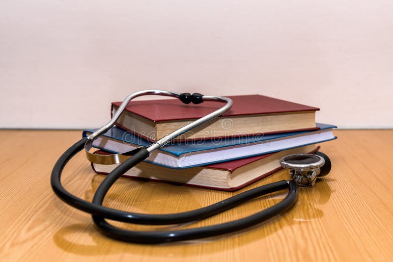 Stethoscope and Medical Books Lying on a Table Stock Photo - Image of ...