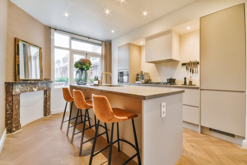 Table in the Middle of the Kitchen with Chairs Stock Photo - Image of ...