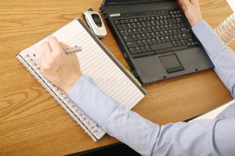 Table with Note and Laptop stock photo. Image of professional - 5560766