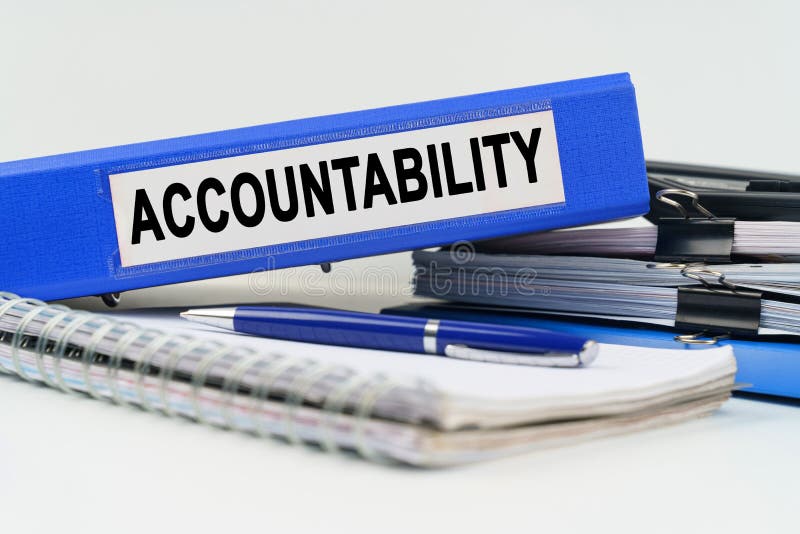 On the Table are a Notebook, a Pen, Documents and a Folder with the ...