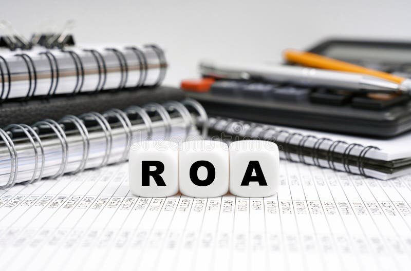 On the Table, among Office Objects, Cubes with the Inscription - ROA ...