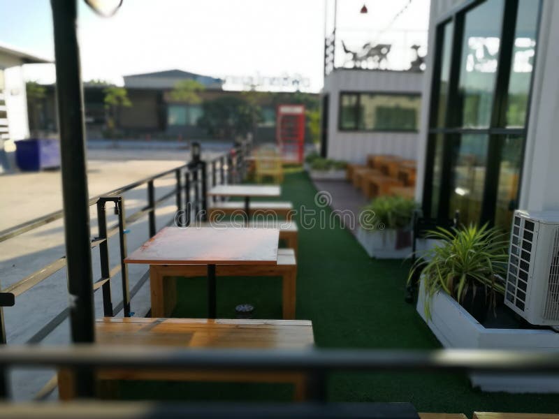Table Outside the Restaurant on Artificial Grass Background Stock Image ...