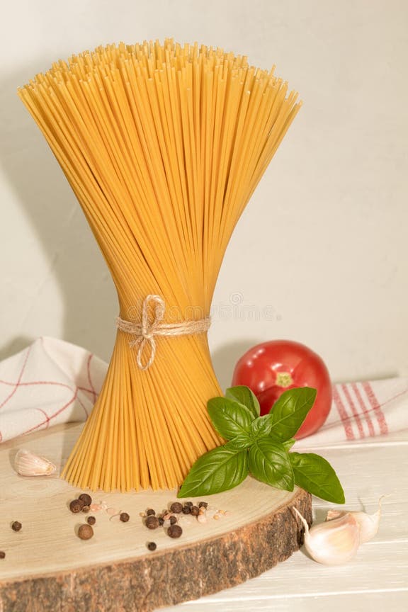 On the Table is a Pack of Spaghetti Tied with String Stock Photo ...