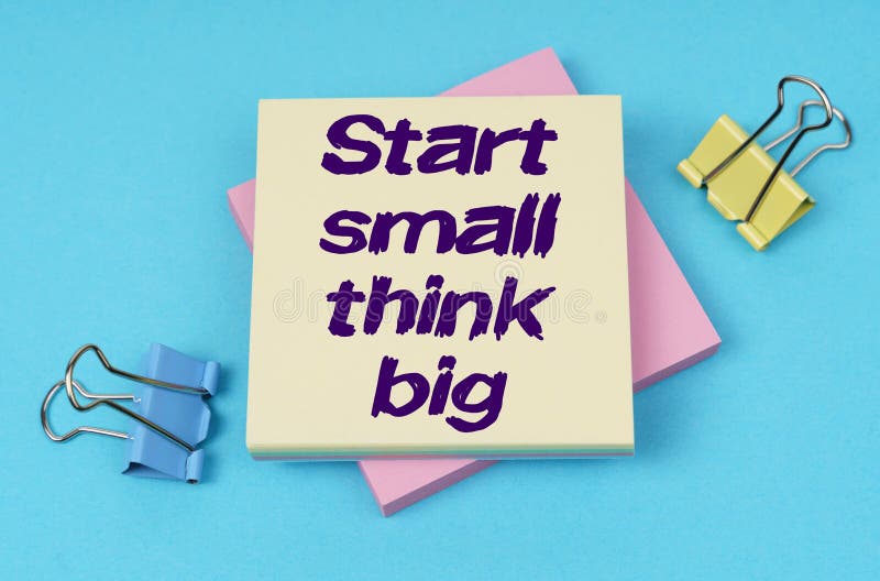On the Table are Paper Clips, Note Paper with Text - Start Small Think ...