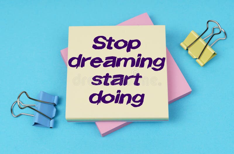 On the Table are Paper Clips, Note Paper with Text - Stop Dreaming ...