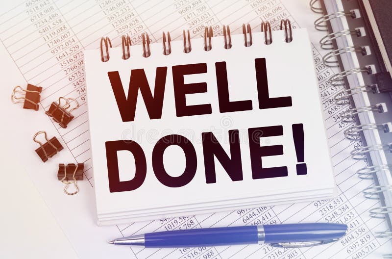 On the Table is a Pen and a Notebook with Inscriptions - WELL DONE ...