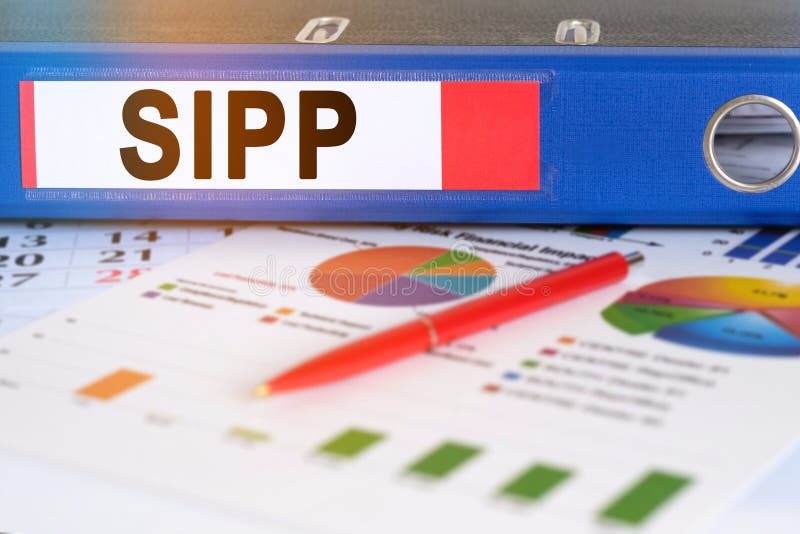 On the Table are Pie Charts, a Pen and a Folder with the Inscription ...