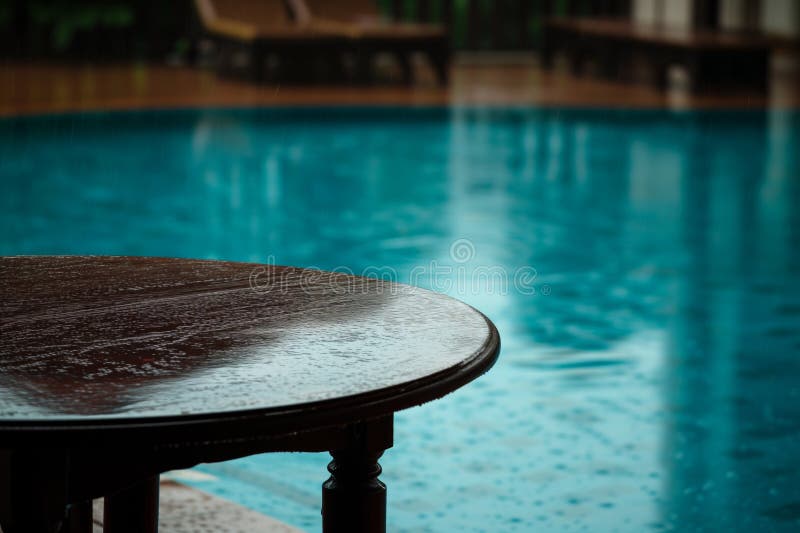 Table by the Poolside with a Wet Surface Stock Photo - Image of ...