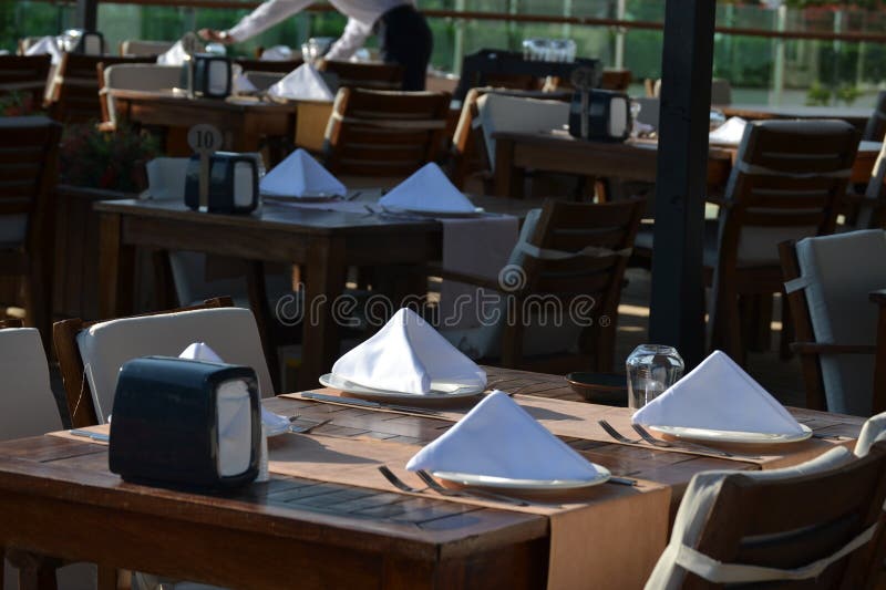 Table Prepared for a Dinner with Plates, Fork, Spoon and Cutlery on ...