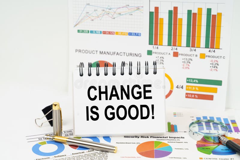 On the Table are Reports with Graphs and a Notepad with the Inscription ...