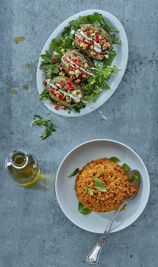 Table with Rice and Stuffed Vegetables Meal with Walnuts Stock Photo ...
