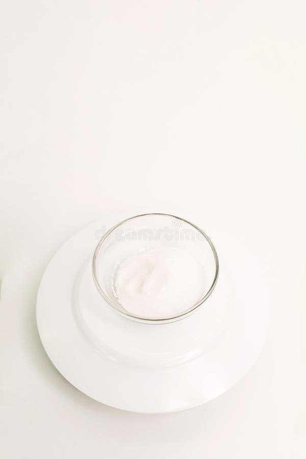 Table Salt in a Glass Plate on a White Background Stock Photo - Image ...