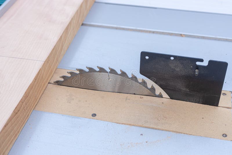 Table Saw Closeup Blade with Wood on the Table. Stock Image - Image of ...