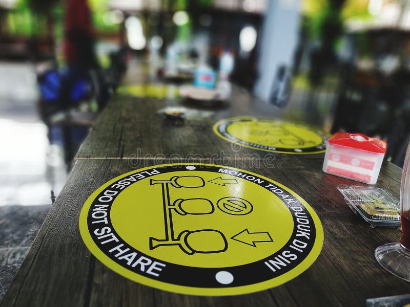 Table Seated Social Distance Stock Photo - Image of poster, lighting ...