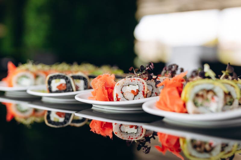 The Table is Served with Four Types of Sushi with Fish, Eel, Avocado ...