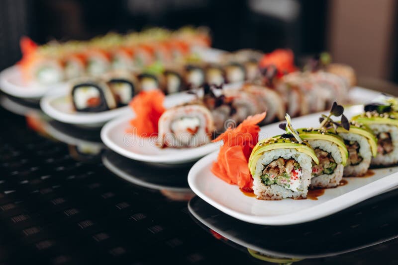 The Table is Served with Four Types of Sushi with Fish, Eel, Avocado ...