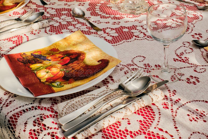 Table Prepared for Thanksgiving Dinner with Silverware and Napkins ...